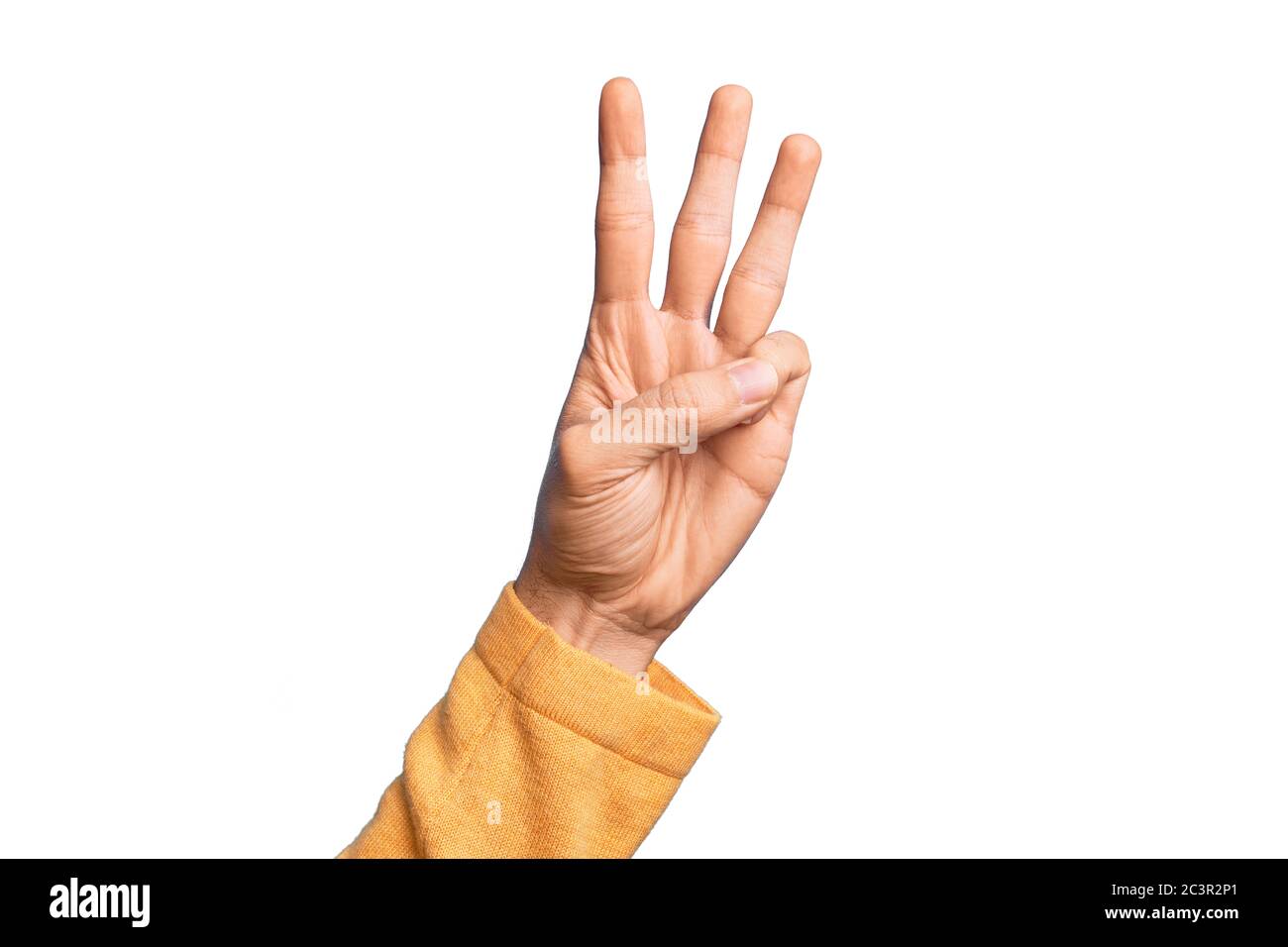 Hand of caucasian young man showing fingers over isolated white background counting number 3 ...