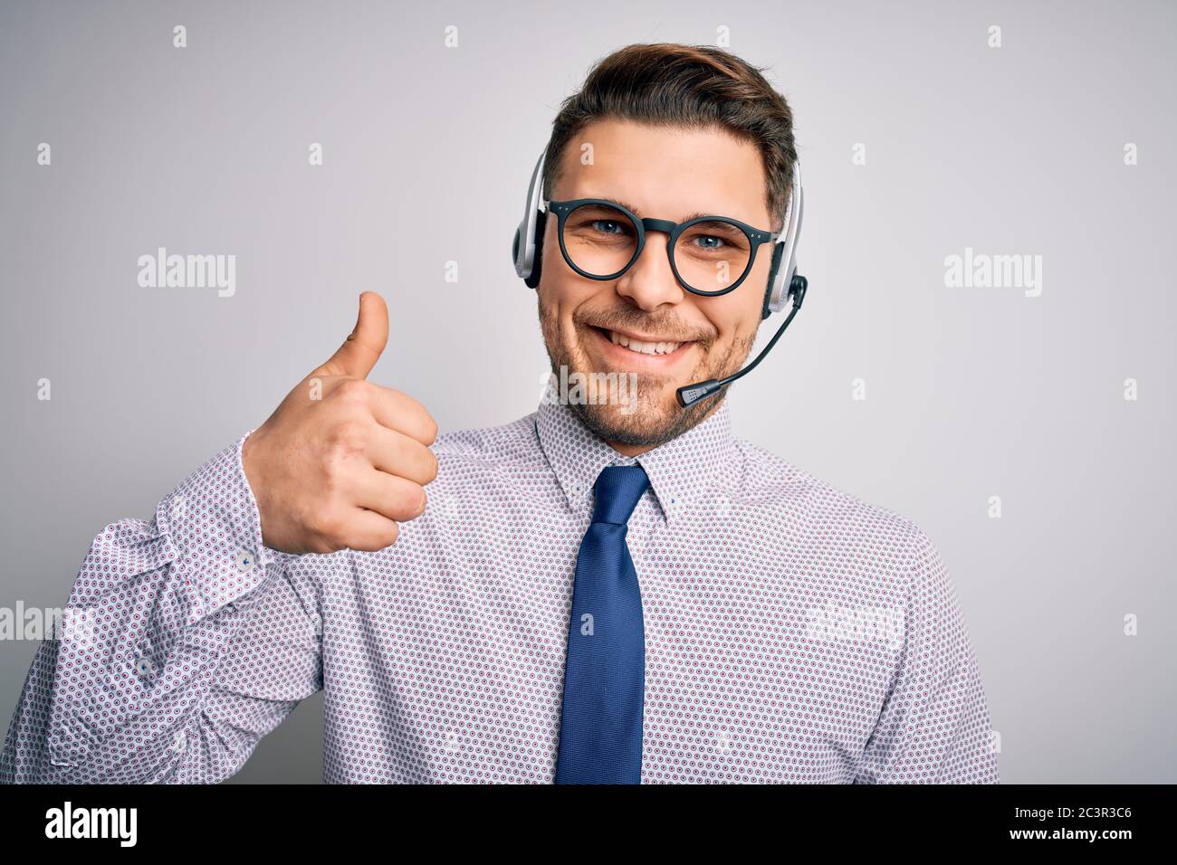 Young call center operator business man with blue eyes wearing glasses ...