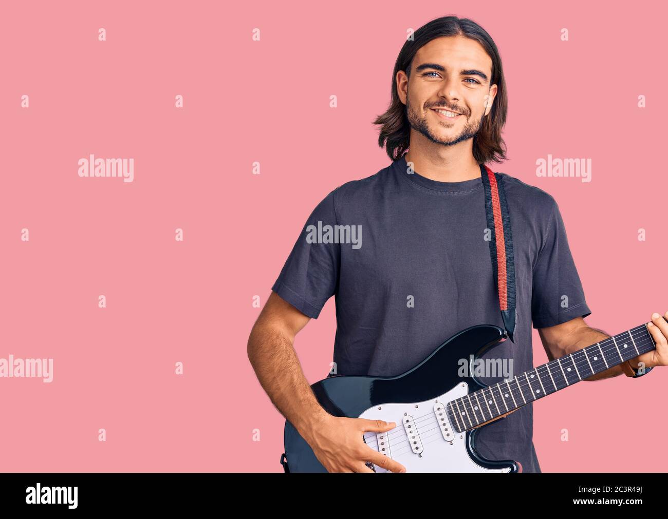 Playing guitar with teeth hi-res stock photography and images - Alamy