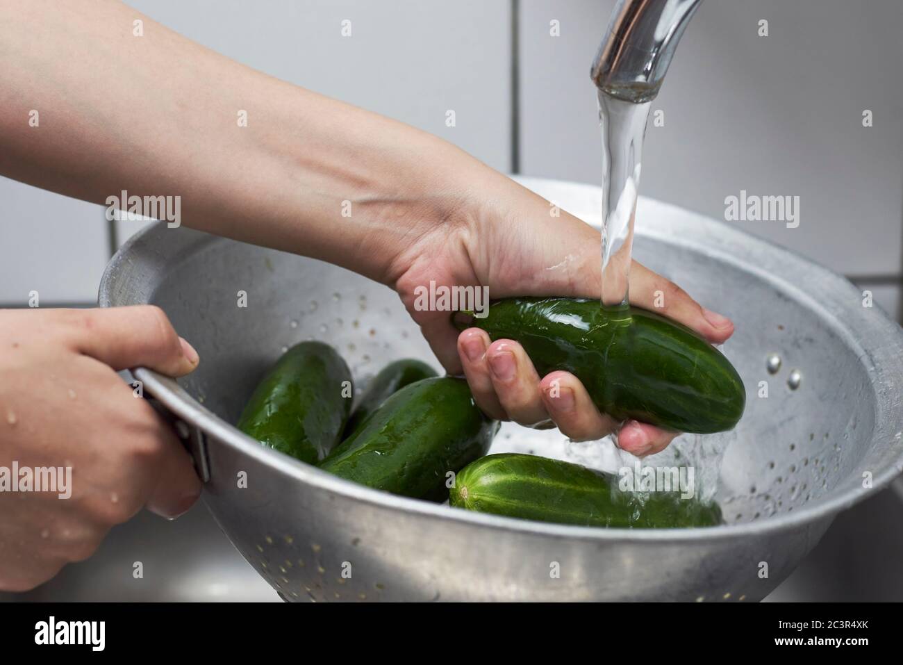 Cucumber washing hi-res stock photography and images - Alamy