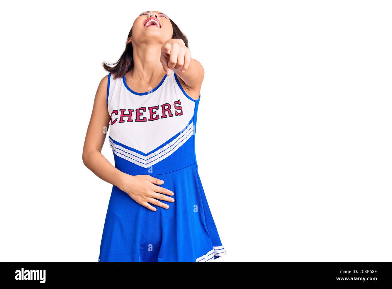 Young beautiful chinese girl wearing cheerleader uniform laughing at ...
