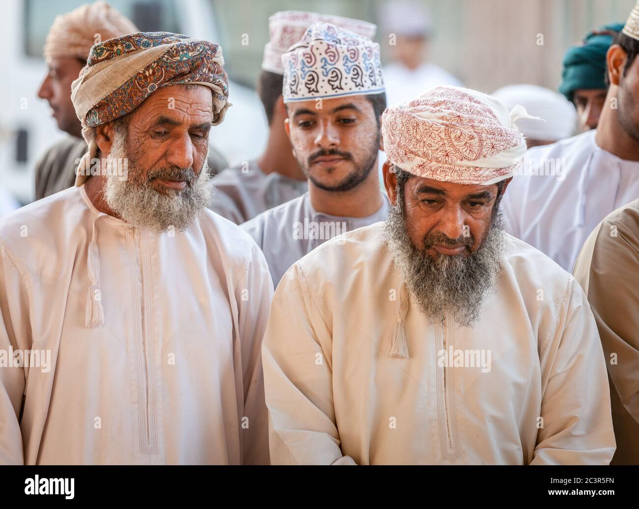 Nizwa, Oman, December 2, 2016: Local men shopping at the Friday goat ...