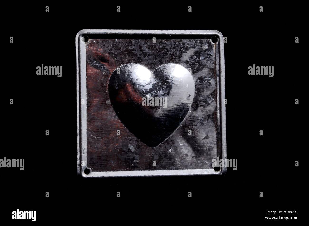 aluminium metal heart love concept on a black background Stock Photo ...