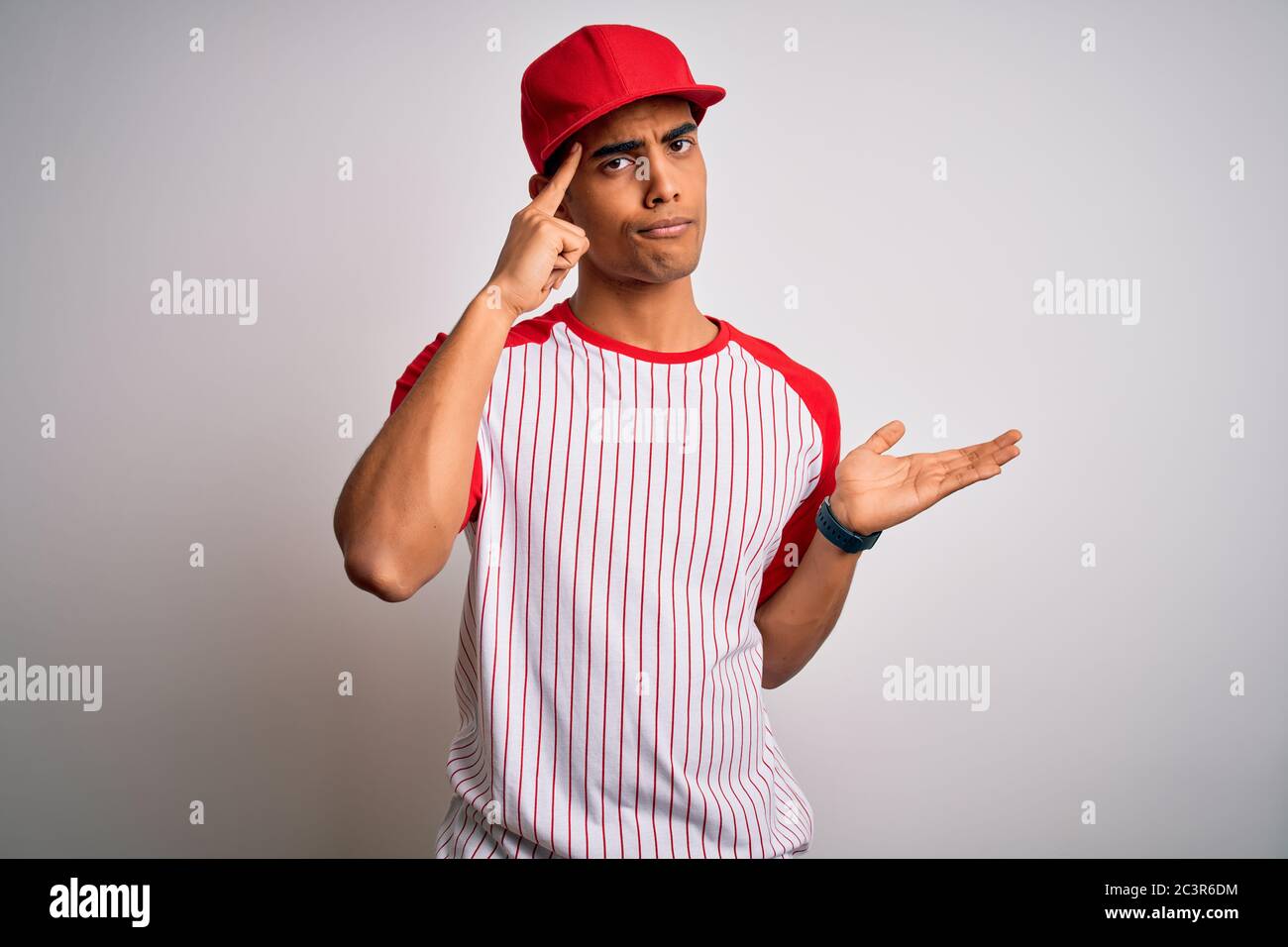 Young handsome african american sportsman wearing striped baseball t ...