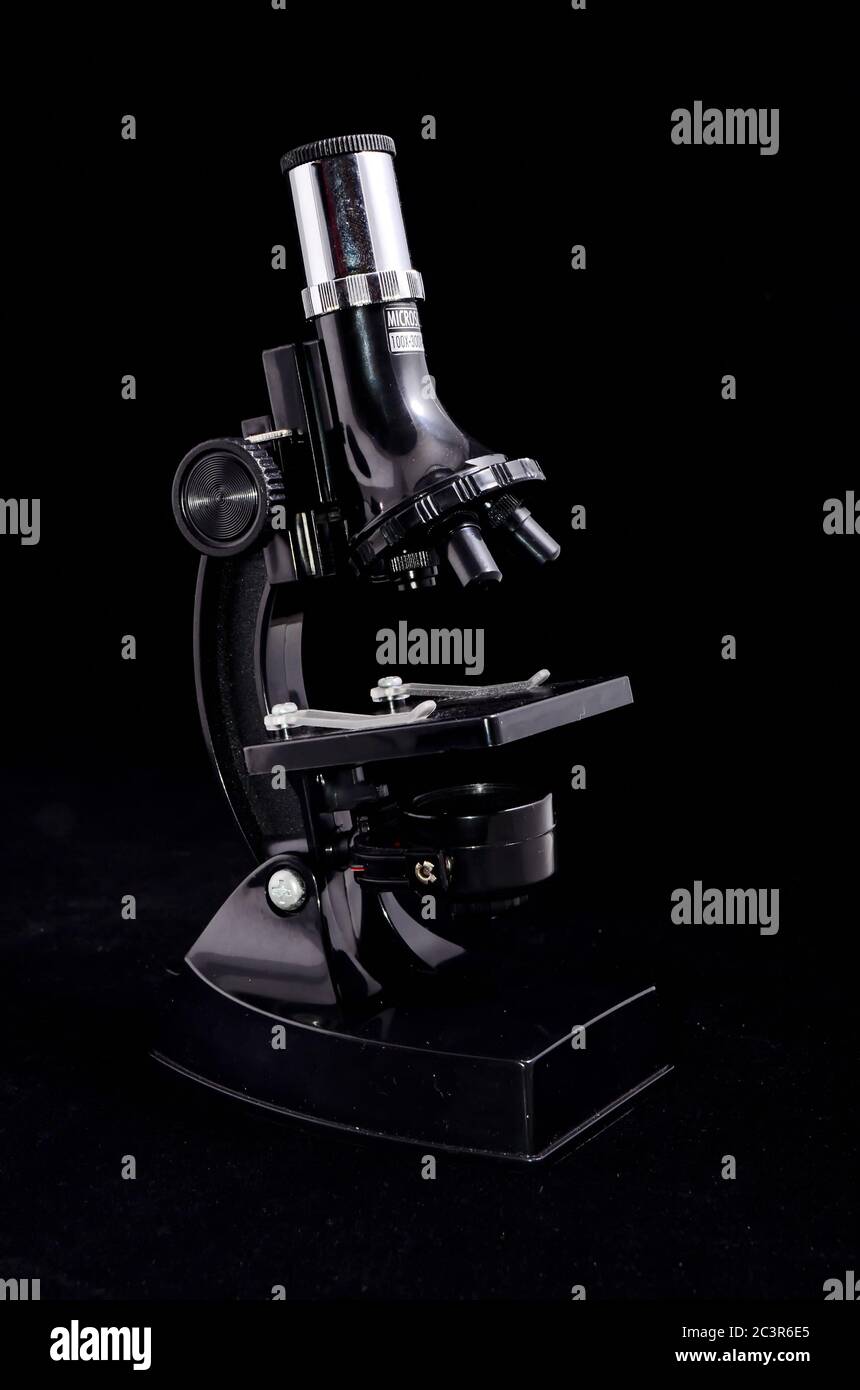Old Vintage Microscope Isolated Over Black Background Stock Photo - Alamy