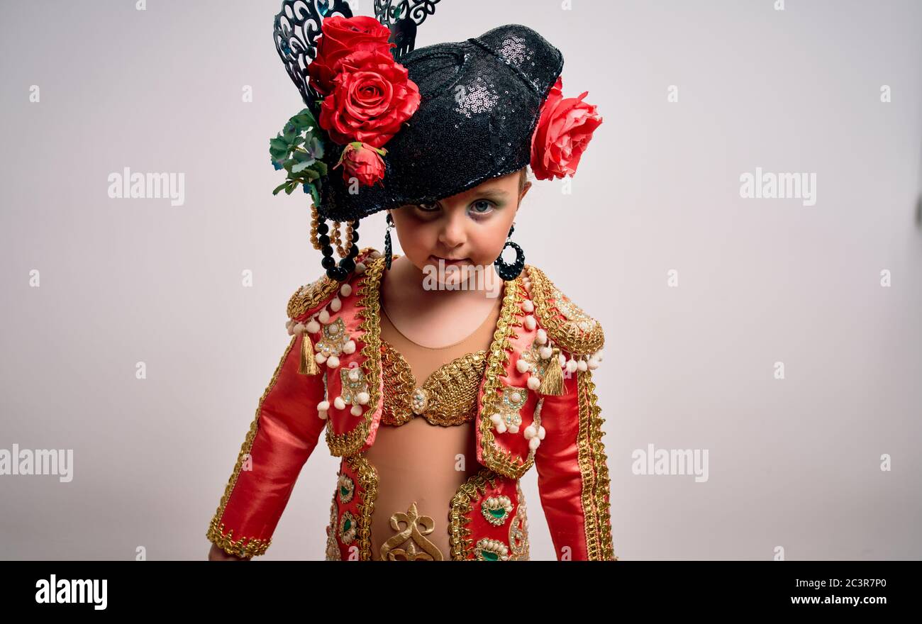 Young little caucasian kid girl wearing bullfighter traditional folkore ...