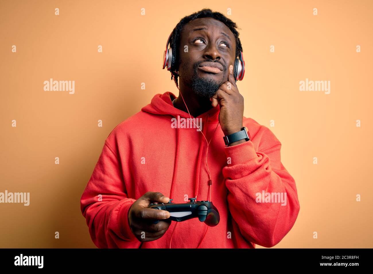 Young african american gamer man playing video game using joystick and ...