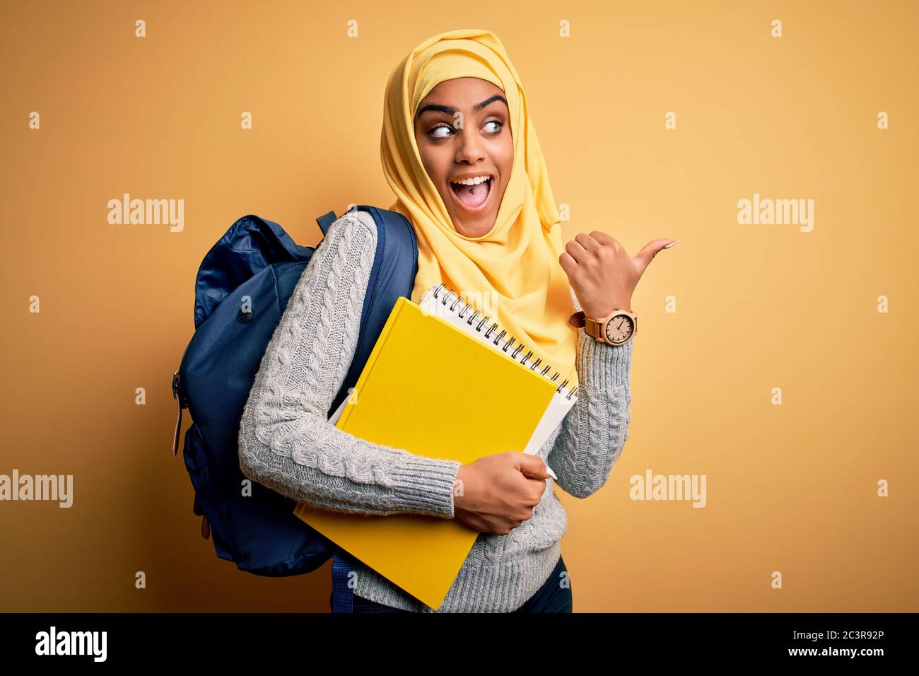 Young african american student girl wearing muslim hijab and backpack ...
