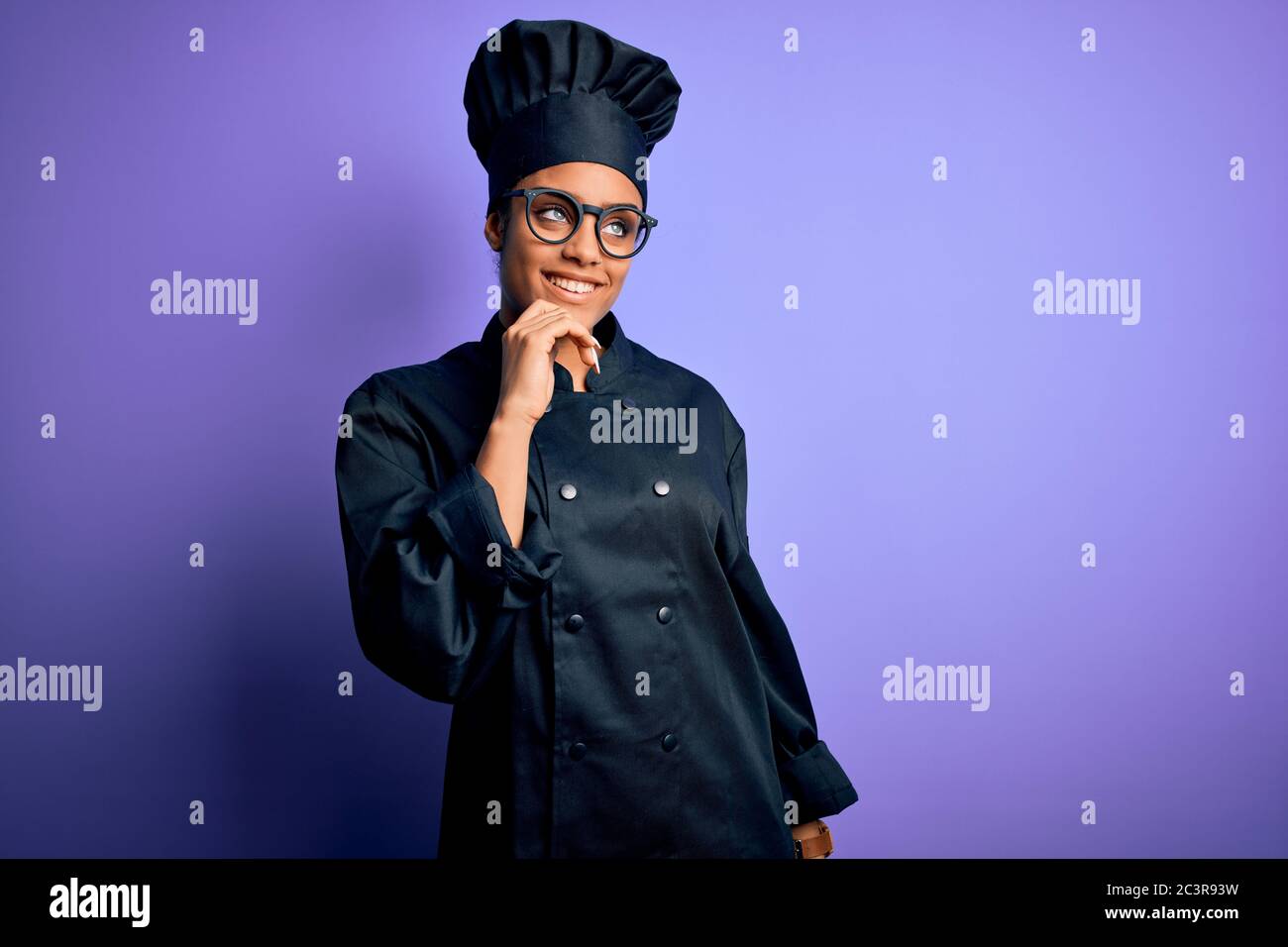 Young african american chef girl wearing cooker uniform and hat over ...
