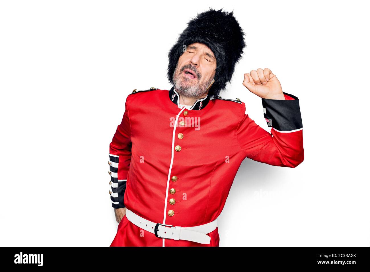 Middle age handsome wales guard man wearing traditional uniform over ...
