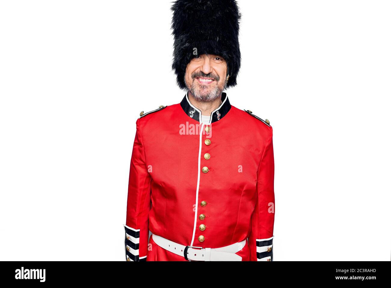 Middle age handsome wales guard man wearing traditional uniform over ...