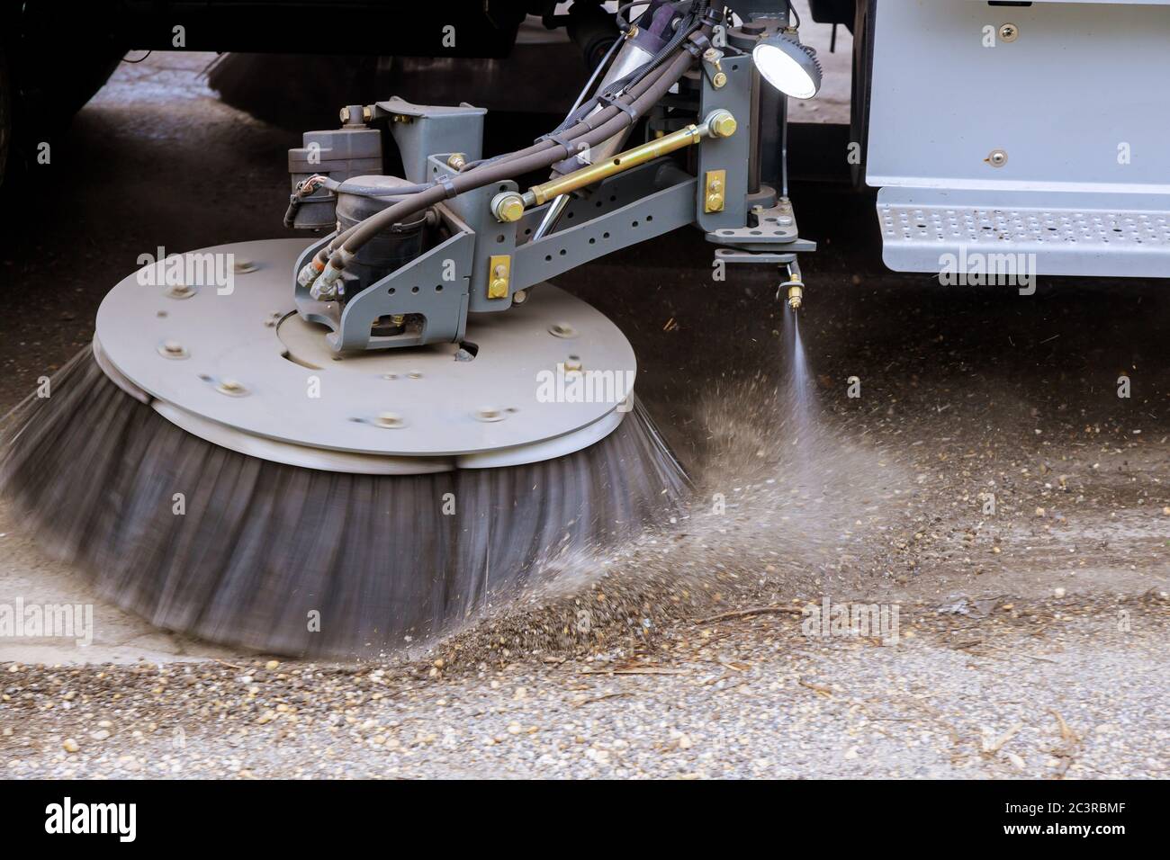Street sweeper machine cleaning the streets in utility service on the ...