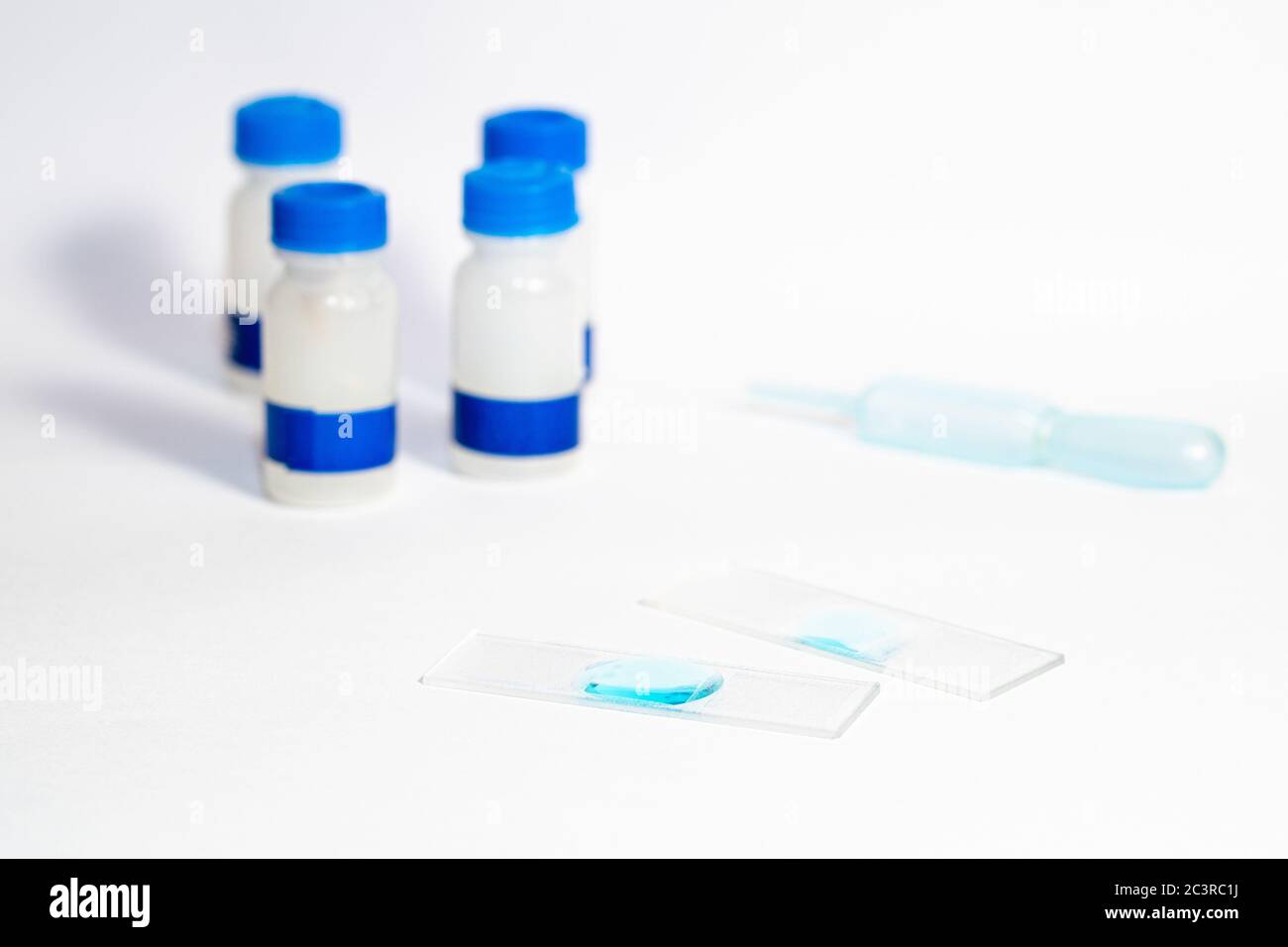 Laboratory samples and bottles of medicine isolated on a white ...