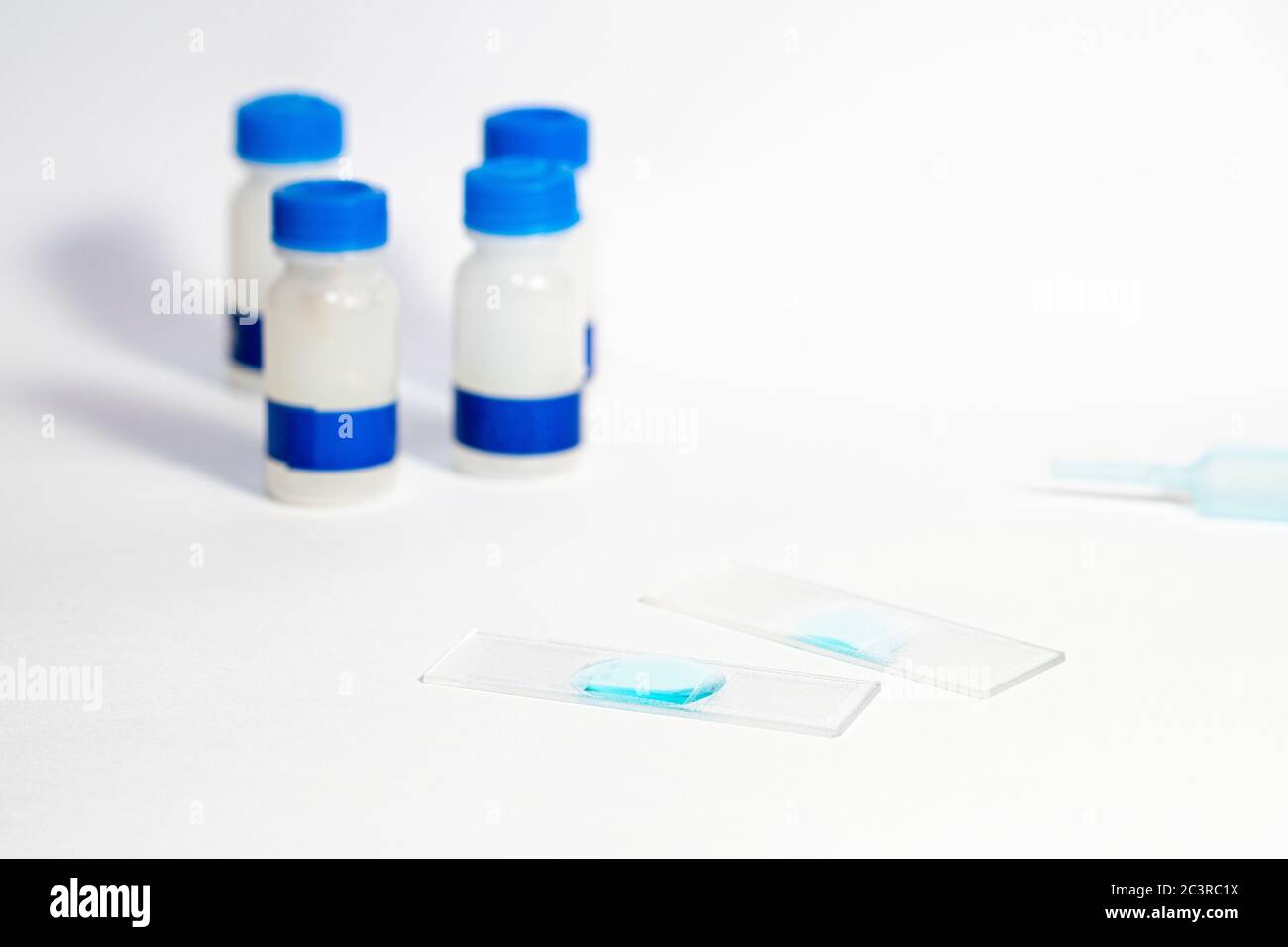 Laboratory samples and bottles of medicine isolated on a white ...