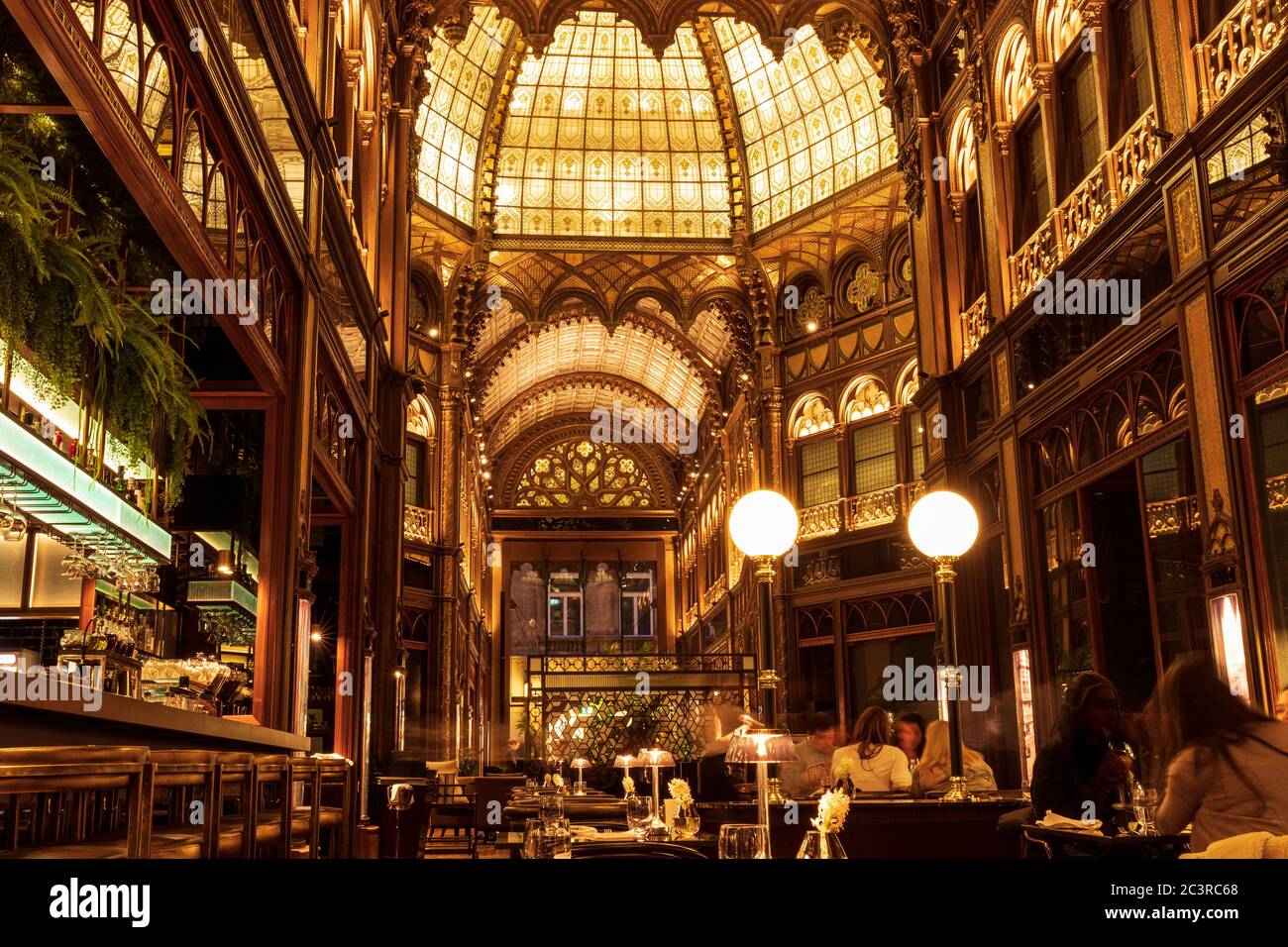 Inside look of a luxurious building with arcs and a dome in golden ...