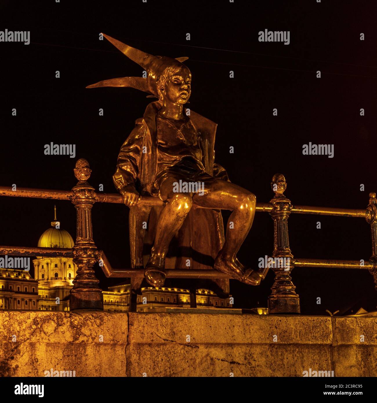 Princess Statue in Budapest Hungary at night and a building with dome ...