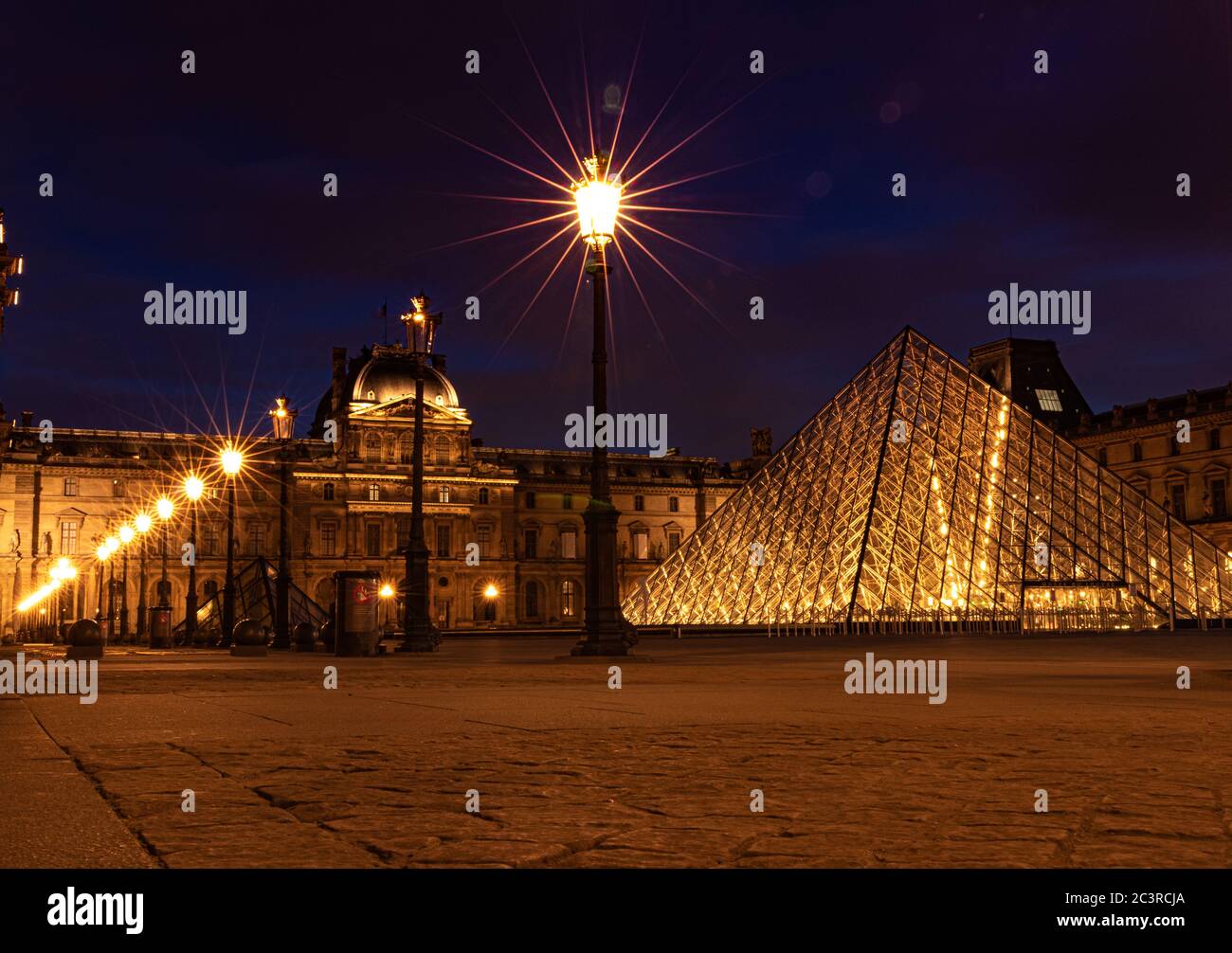 Beautiful scenery of the famous illuminated Louvre in Paris, France at ...