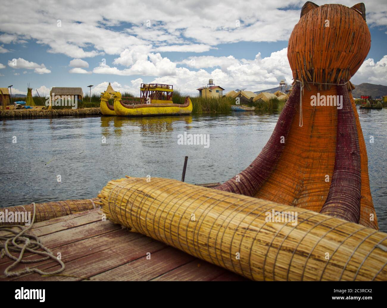 Reed boats on the lake under the cloudy sky Stock Photo - Alamy