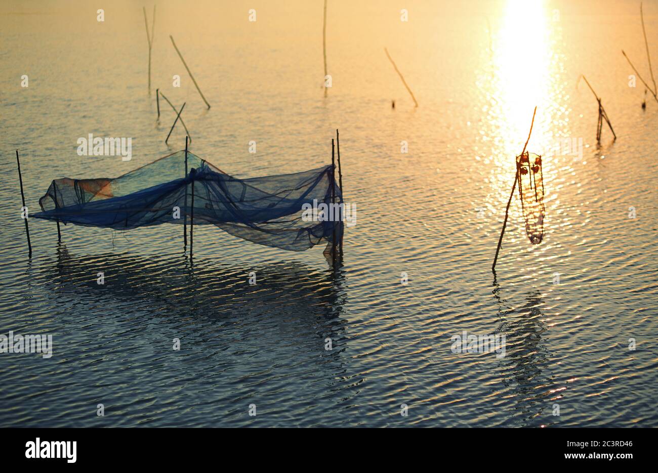 Net traps sky sun hi-res stock photography and images - Alamy