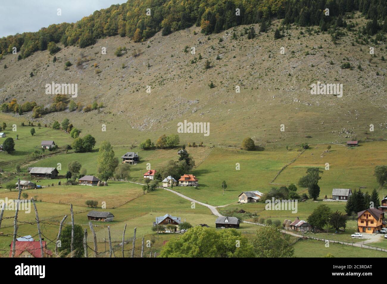 The main road and houses in the village of Sirnea, Brasov County ...