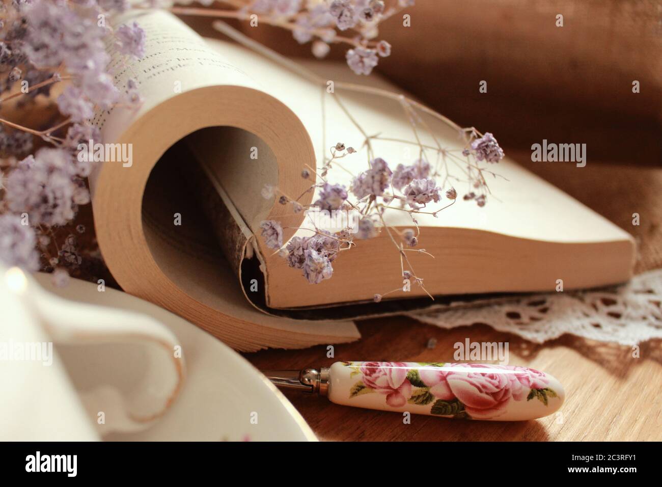 Book under table hi-res stock photography and images - Alamy