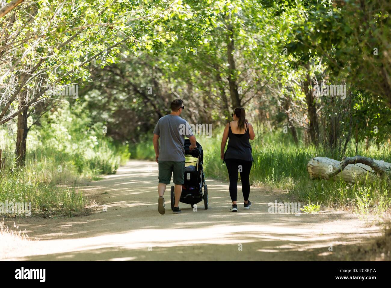 Couple pushing girl child hi-res stock photography and images - Alamy