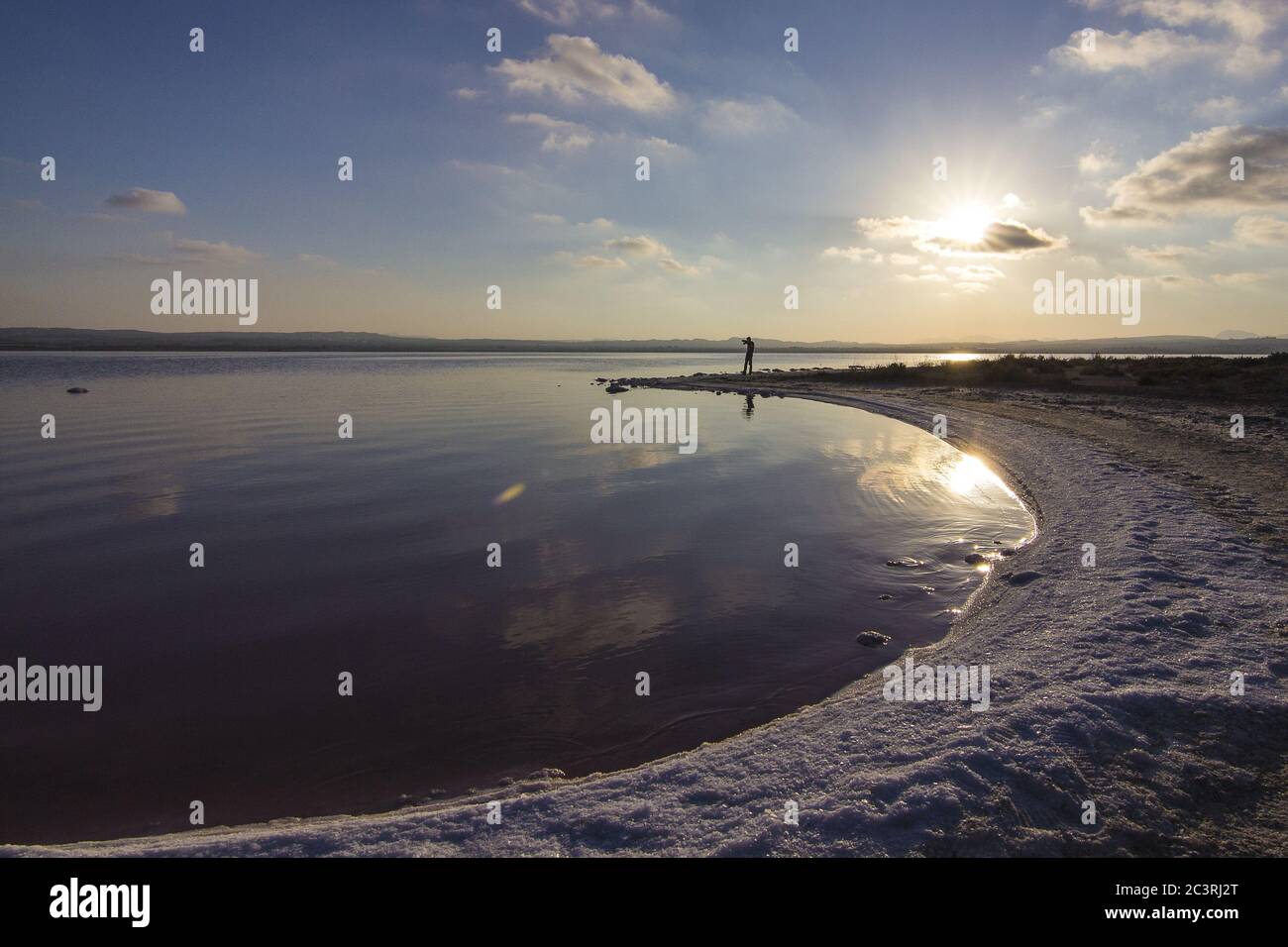 Beautiful scenery of a salty beach during a sunrise Stock Photo - Alamy