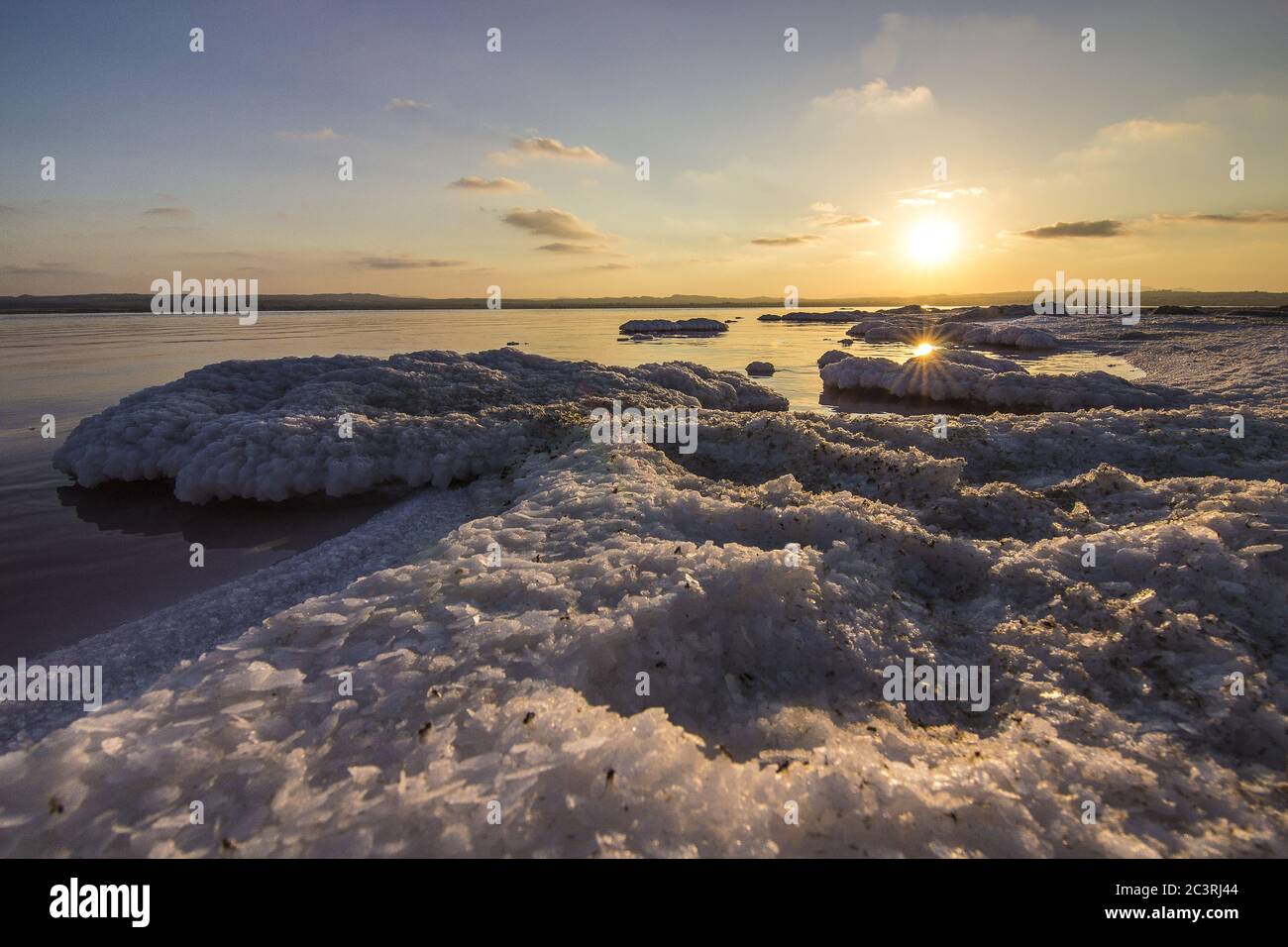 Beautiful scenery of a salty beach during a sunrise Stock Photo - Alamy