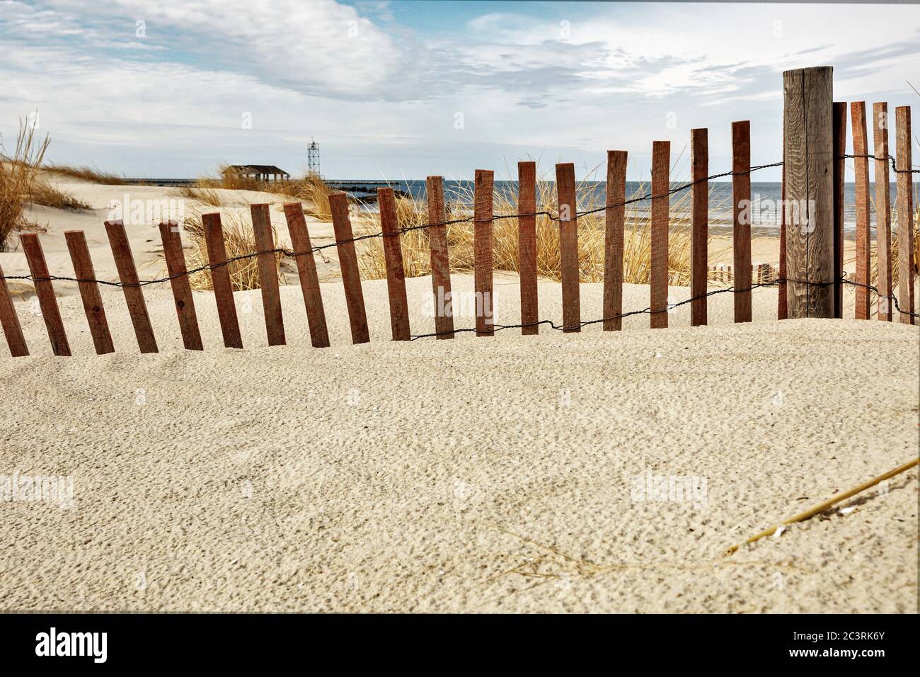 Sand and wind fencing on the sand dunes of North Carolina to help hold ...