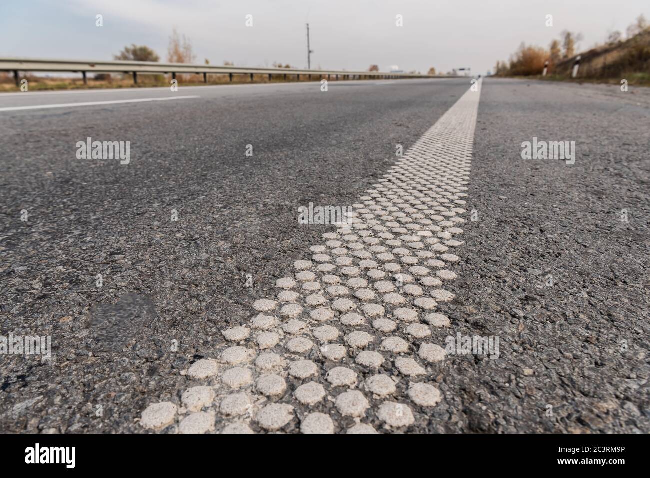 lane on grey asphalt on empty highway Stock Photo - Alamy