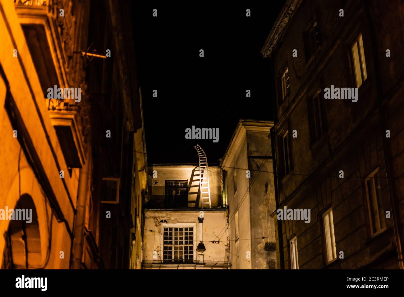 selective focus of houses with light in windows at night Stock Photo ...