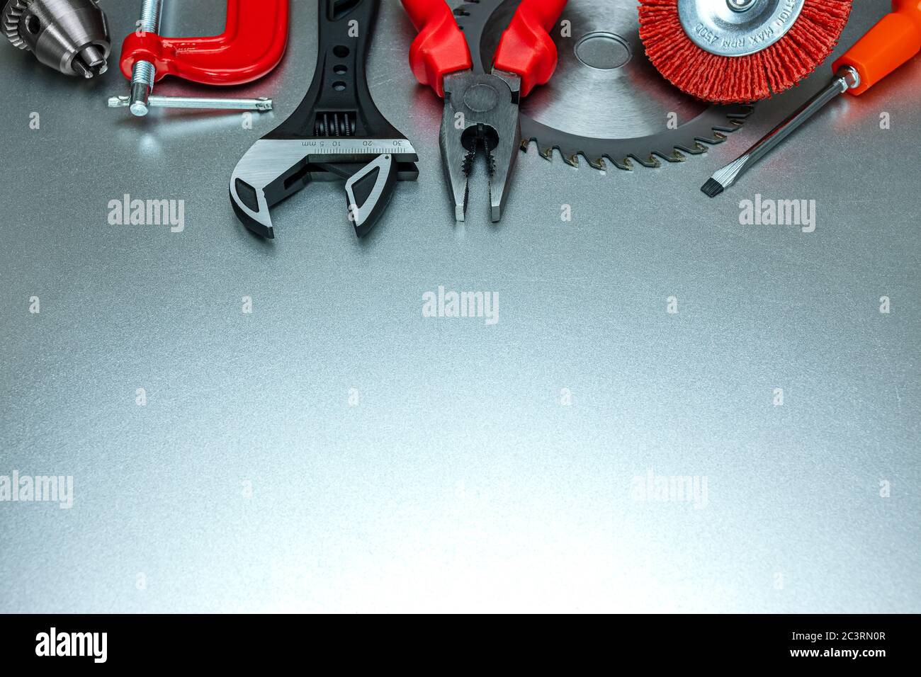 set of different hand tools for house renovation on metal background ...