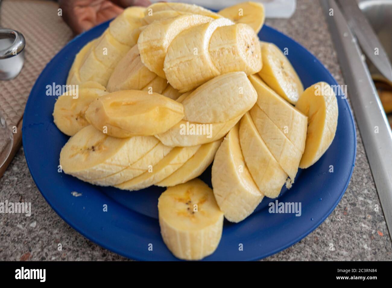 Raw Plantain Slices ready to deep fry to make Dodo Stock Photo - Alamy