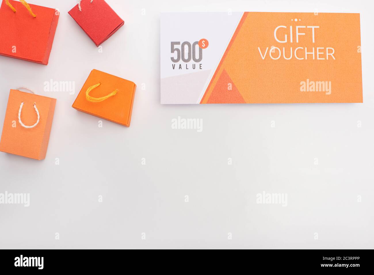 Top view of gift voucher with 500 dollars value lettering near toy ...