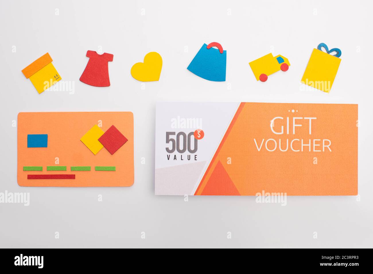Top view of paper credit card near gift voucher and paper craft on ...