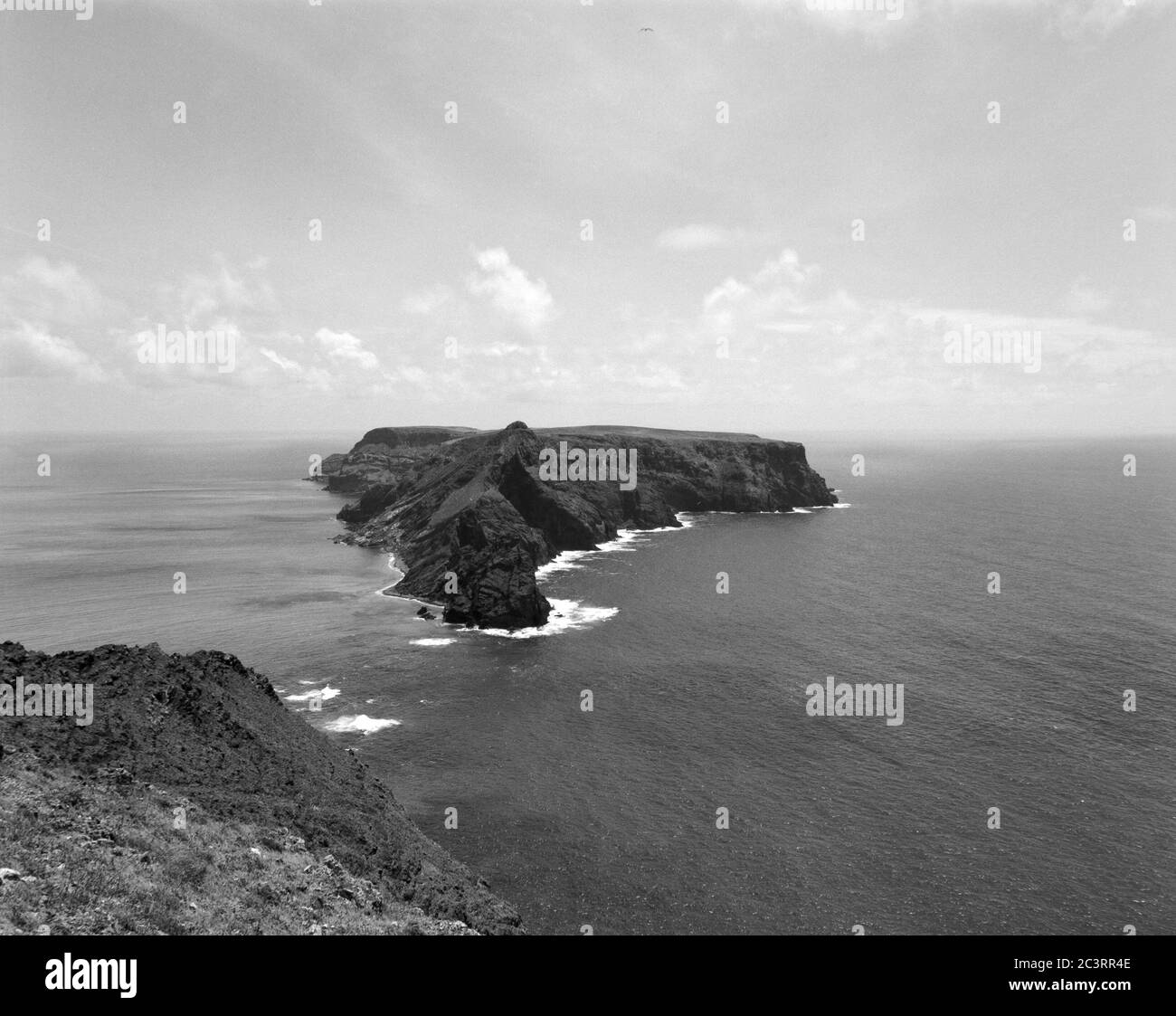 Greyscale shot of rock formations in the ocean Stock Photo - Alamy