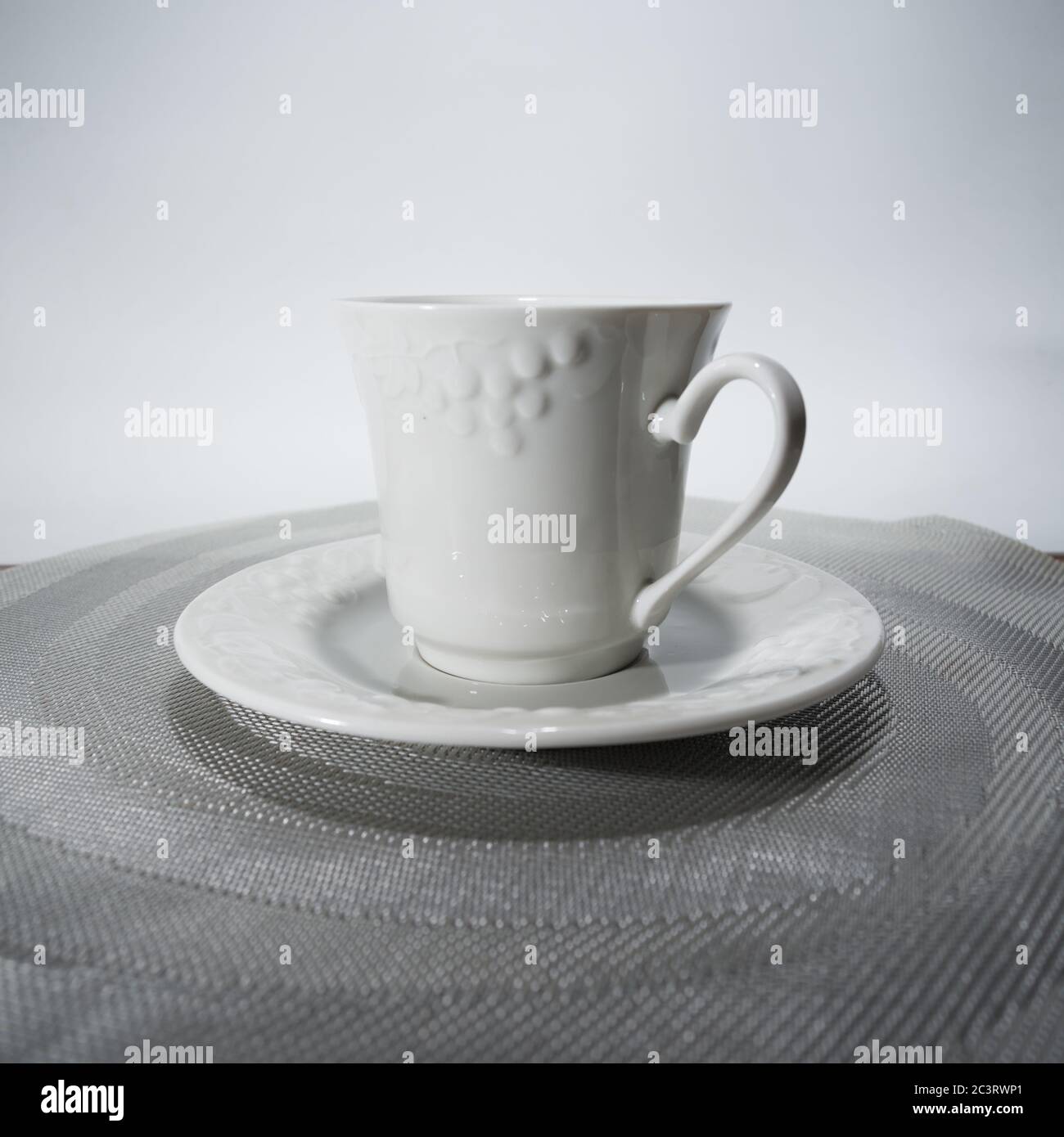 White teacup isolated on a white background Stock Photo - Alamy