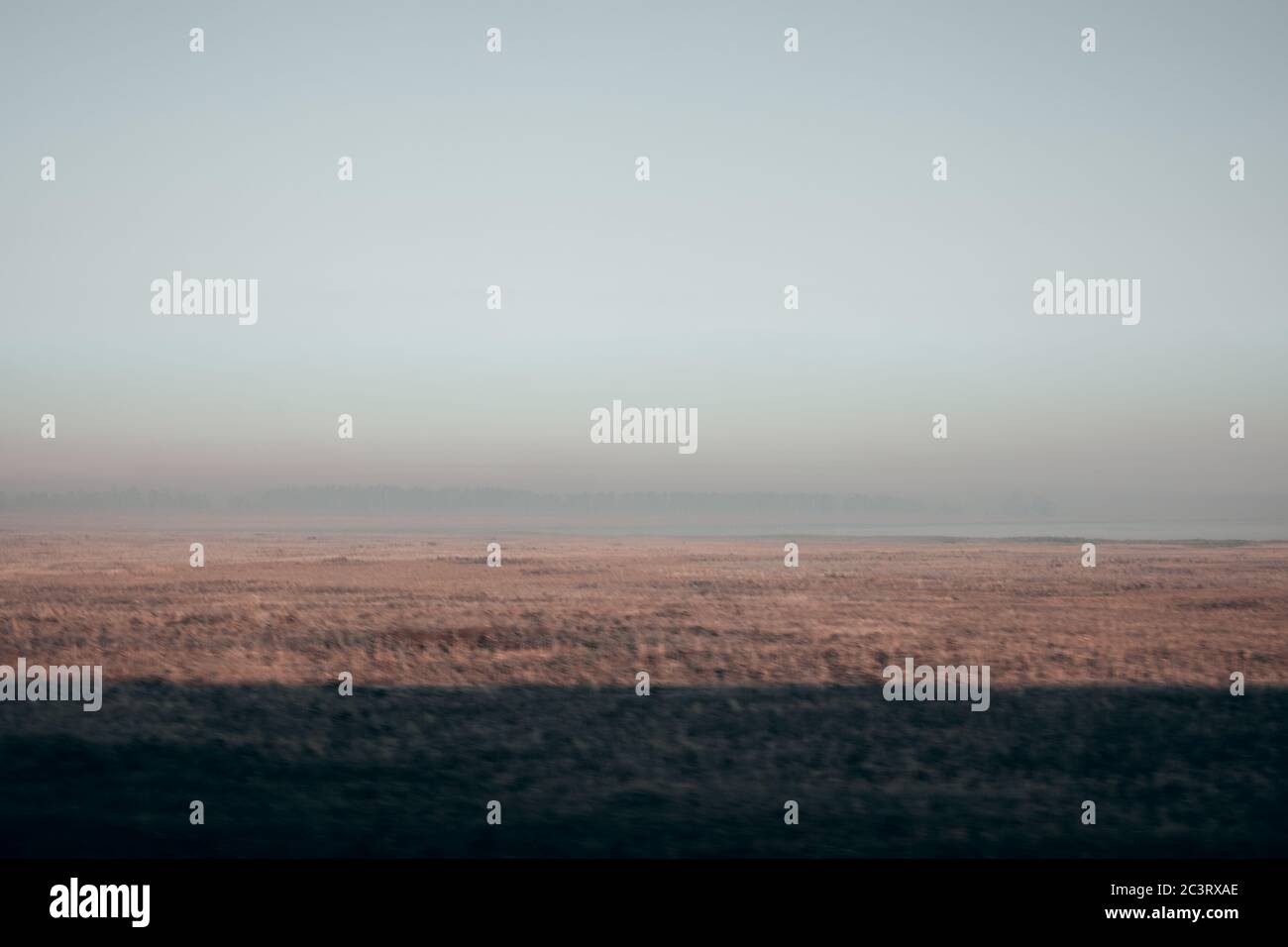 Fog over the lake during sunrise Stock Photo - Alamy