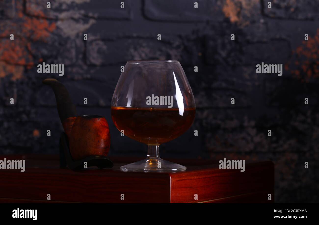 still life with a pipe for smoking and alcohol men's history Stock ...