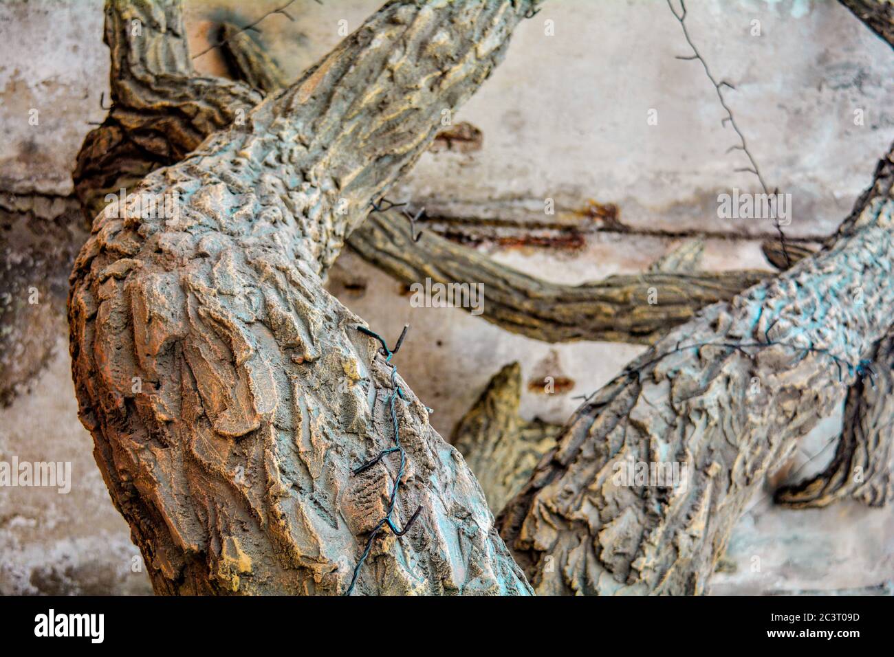 Clumsy artificial tree supports roof like decorative pillar ...