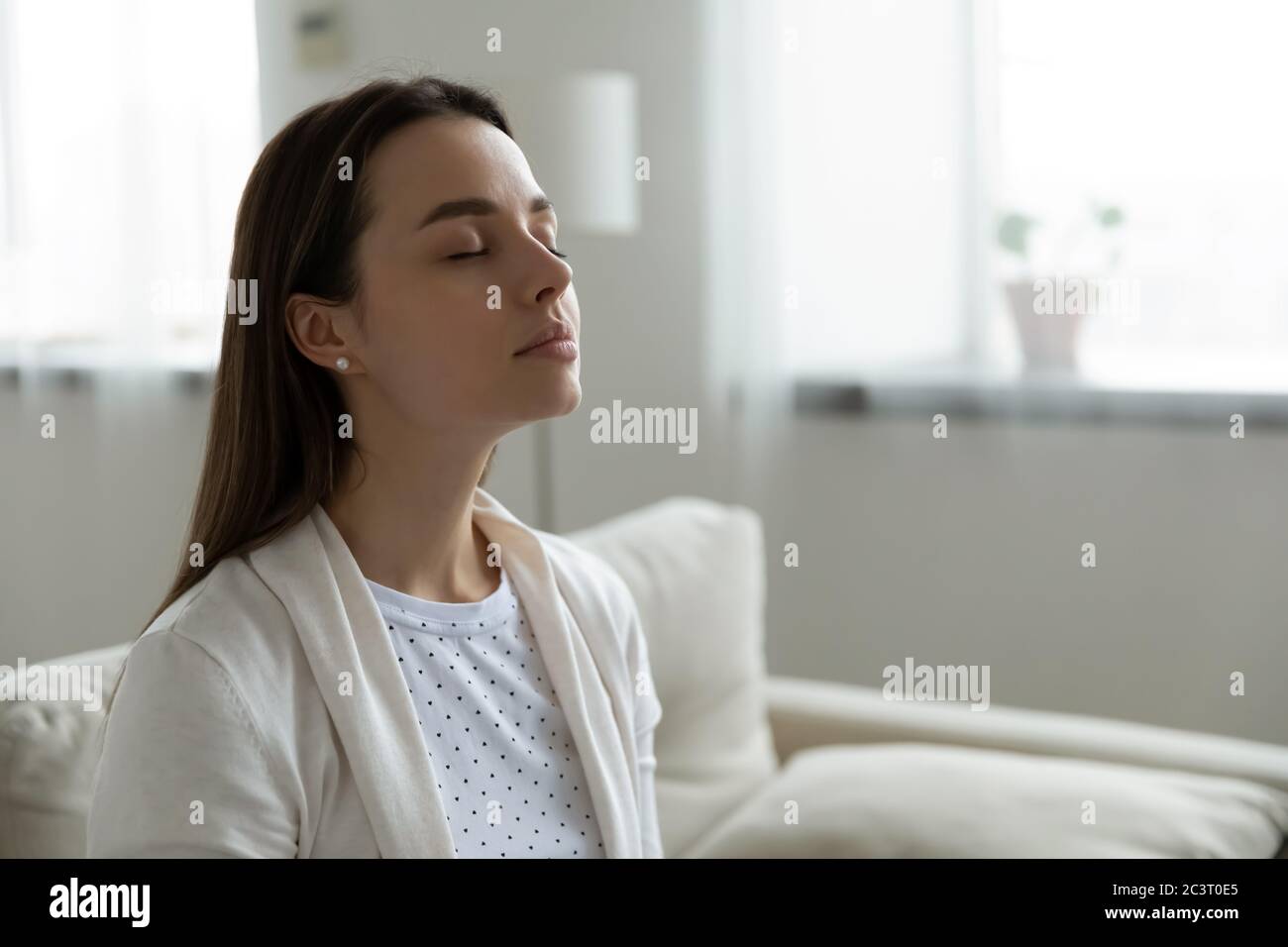 Calm woman resting closed eyes breathing fresh humidified air Stock ...