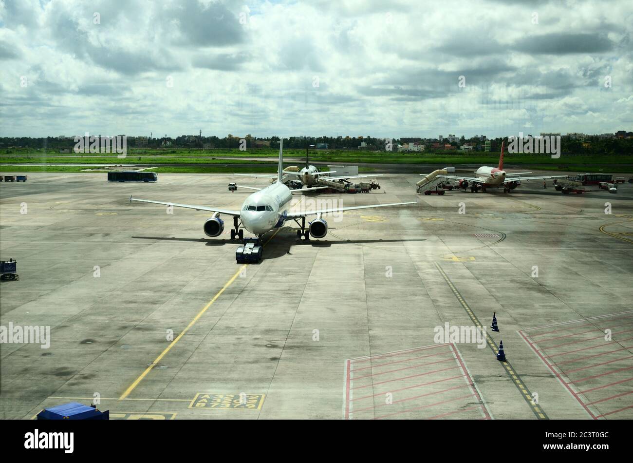 Passenger aircraft taxiing to terminal, in airport Stock Photo - Alamy