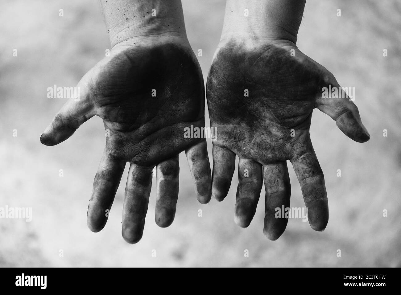 Dirty hands worker hands man / Open hands stained , black and white ...