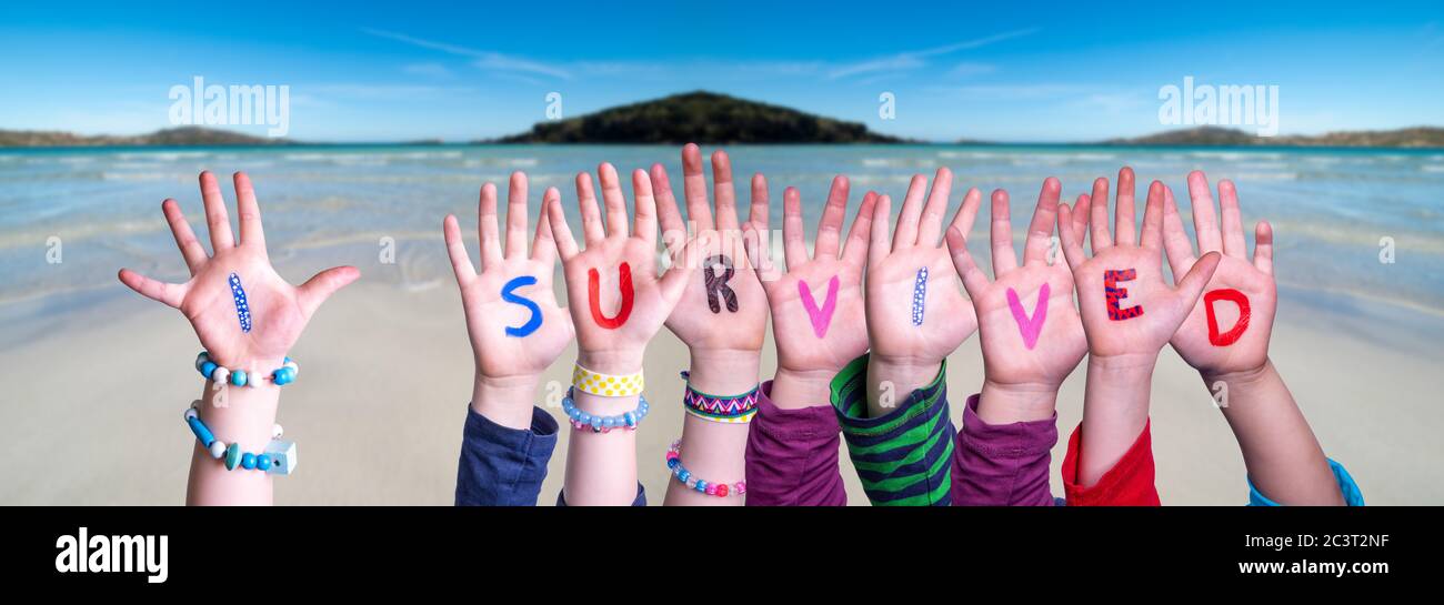 Children Hands Building Word I Survived, Ocean Background Stock Photo ...