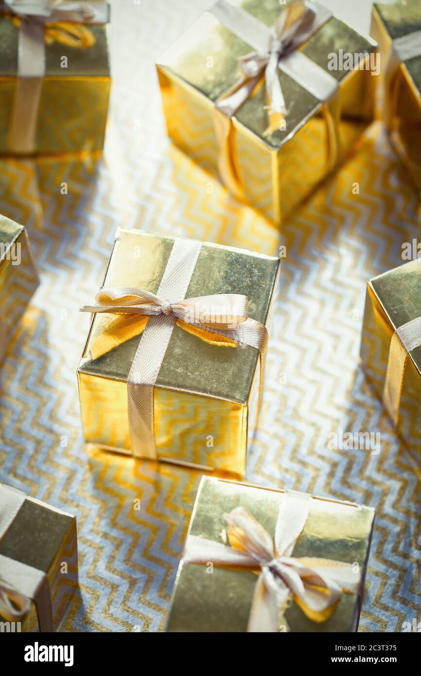 Group of gold sparkling gift boxes, beautiful gold packaging surprise ...