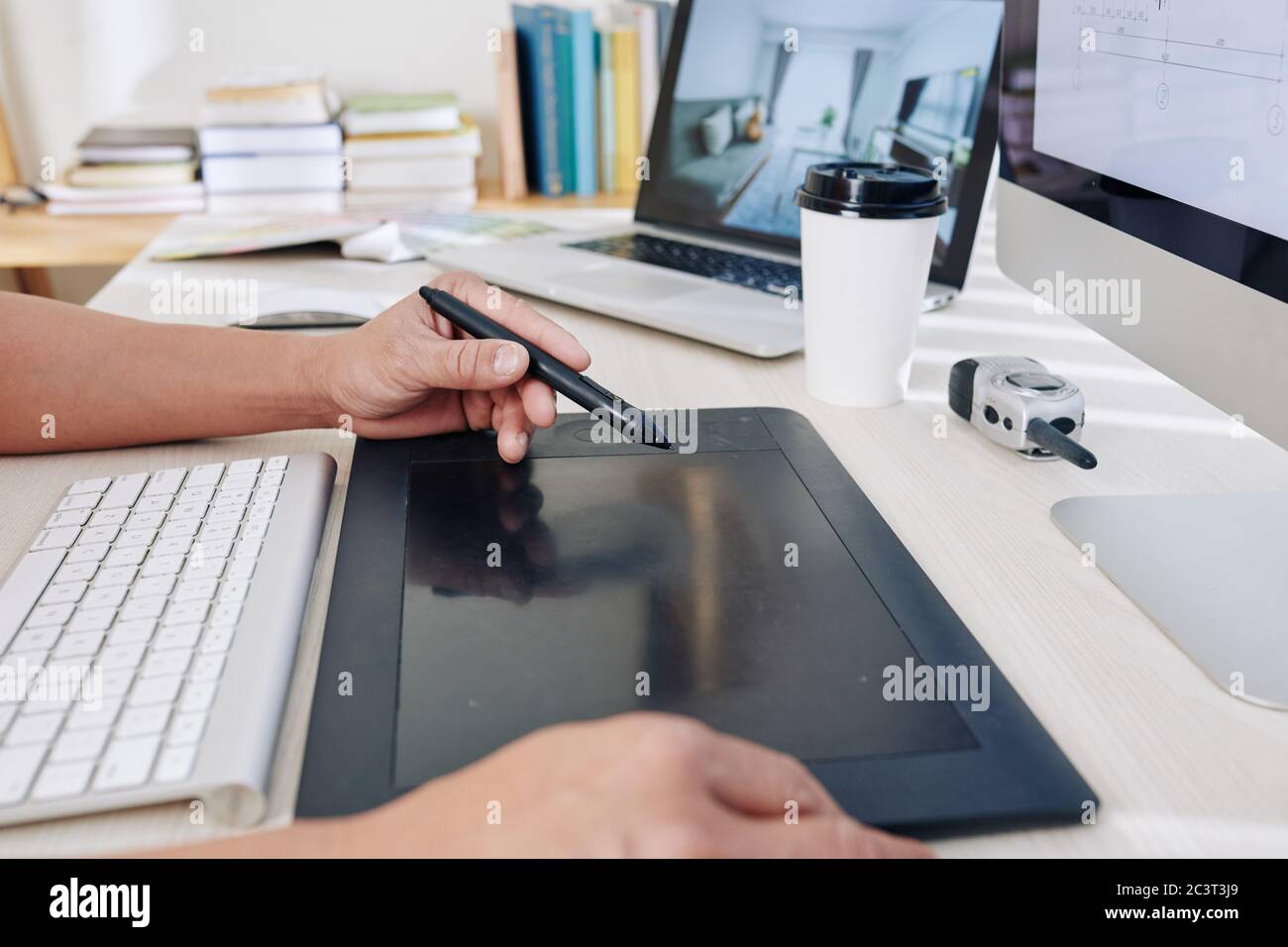 Close-up image of designer using graphic tablet and stylus when drawing ...