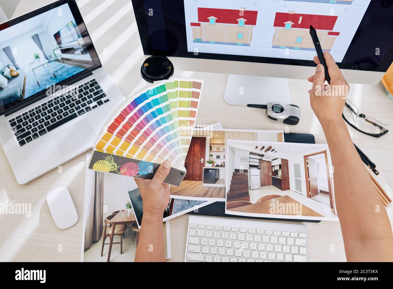 Interior designer working on color scheme for interior and exterior of ...
