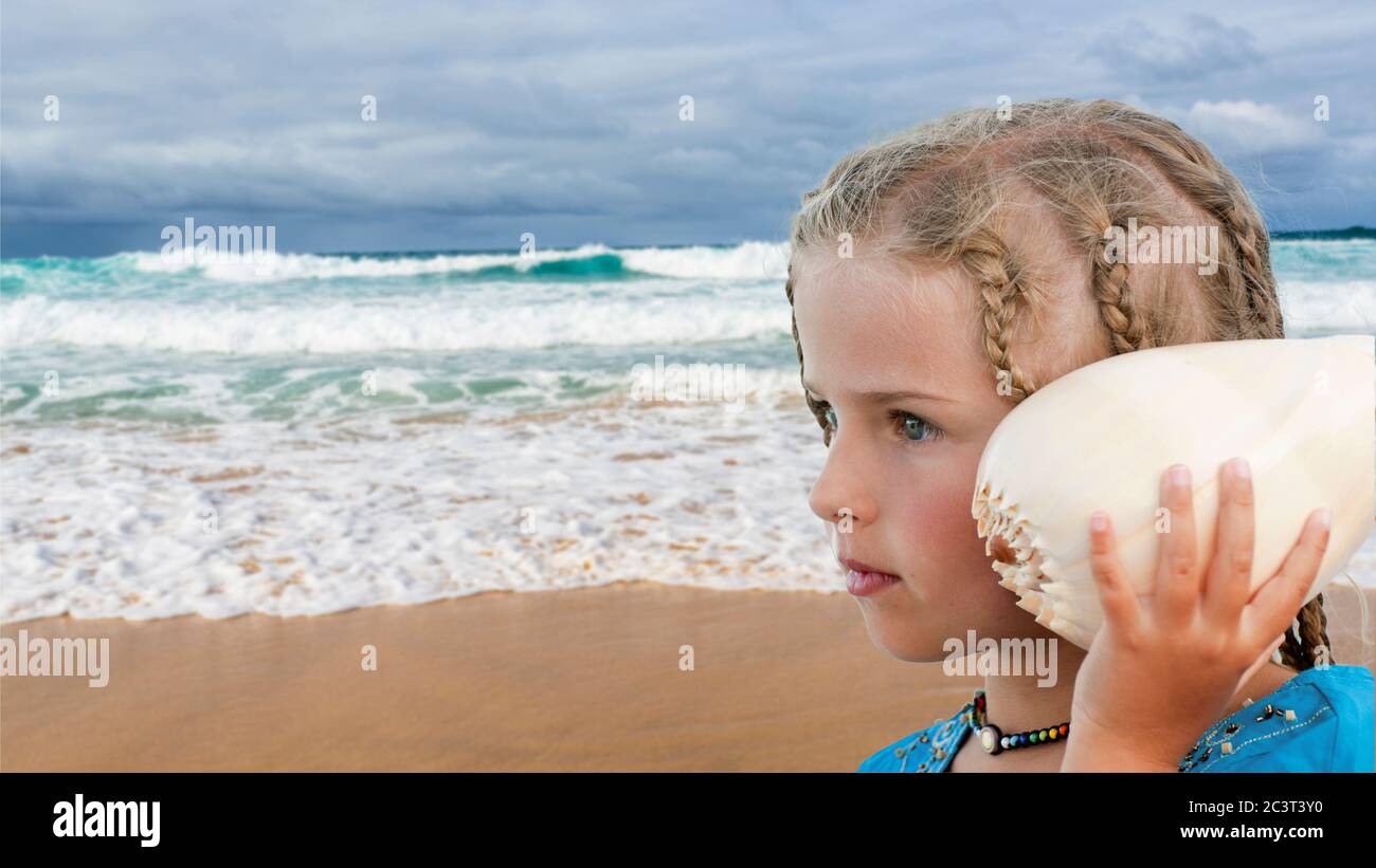 Little girl with seashell hi-res stock photography and images - Alamy
