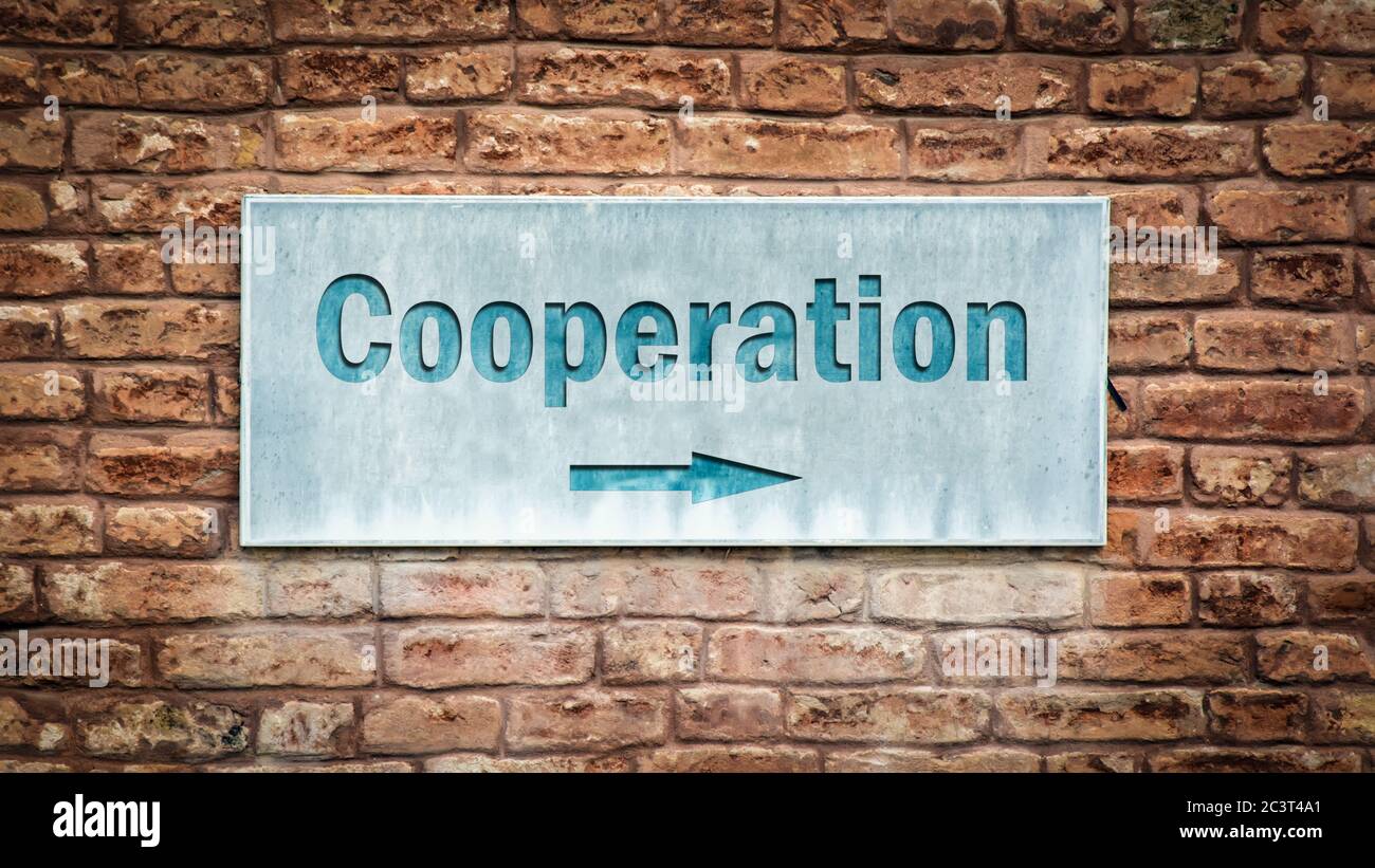 Street Sign the Direction Way to Cooperation Stock Photo - Alamy