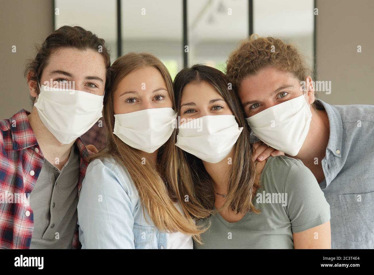 a group of young people with masks Stock Photo - Alamy